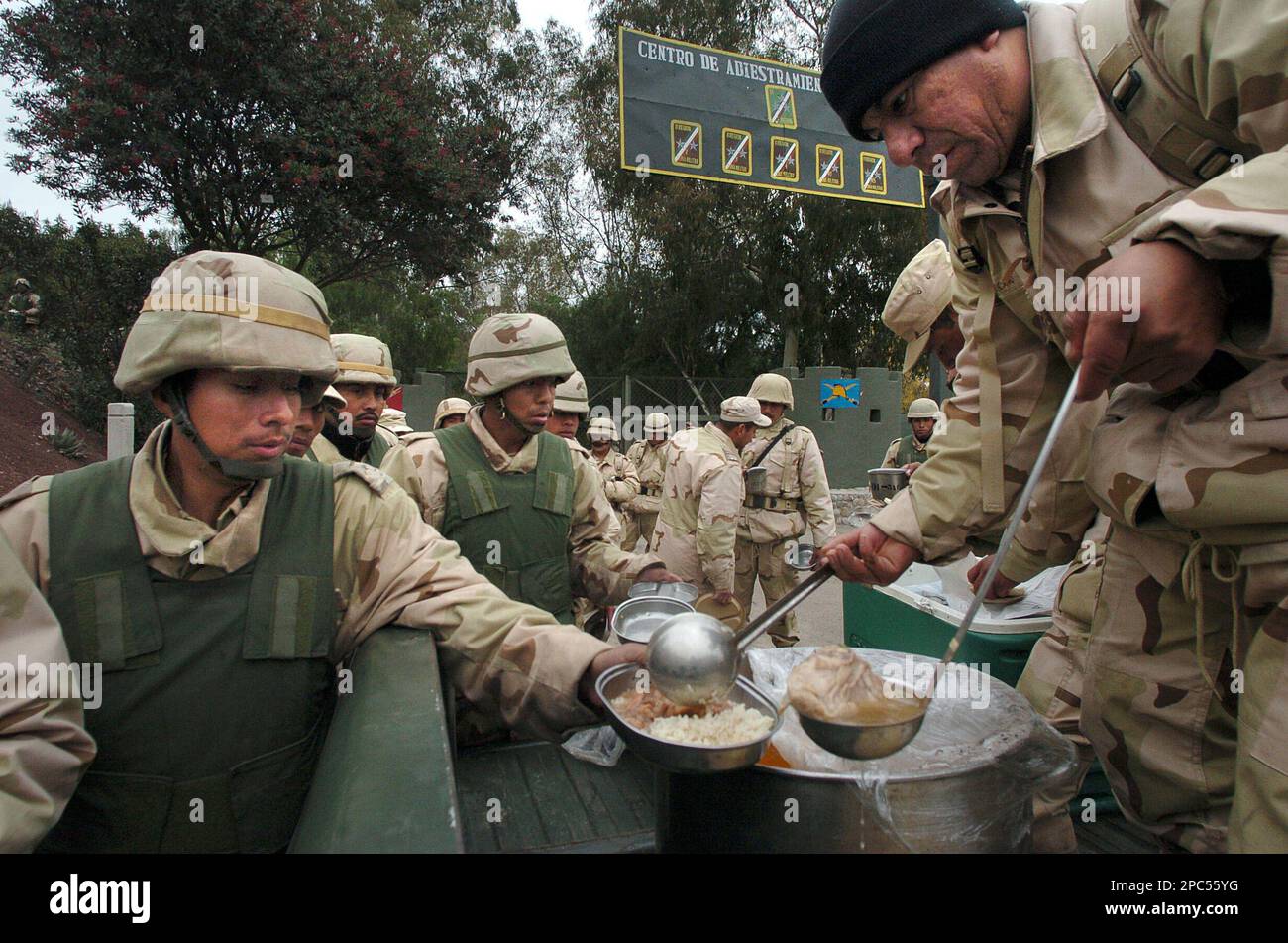 Mexican army soldiers line up for lunch at a military checkpoint in ...