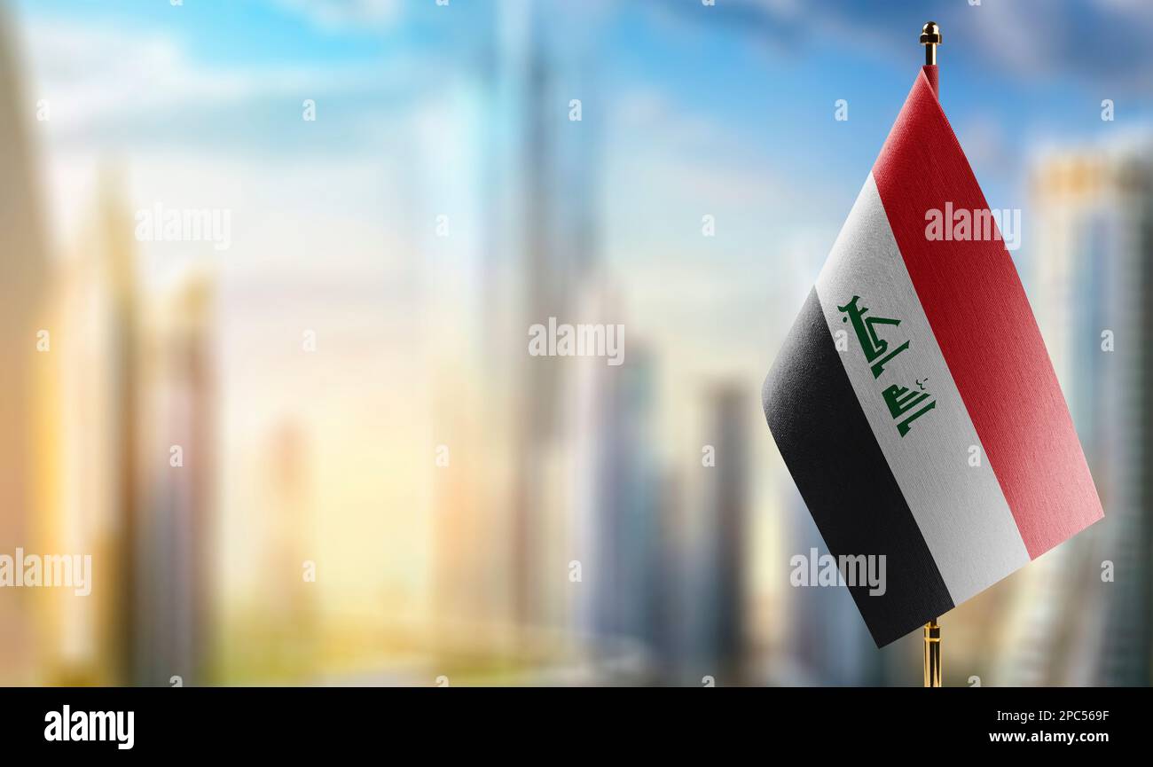 Small flags of the Iraq on an abstract blurry background Stock Photo ...