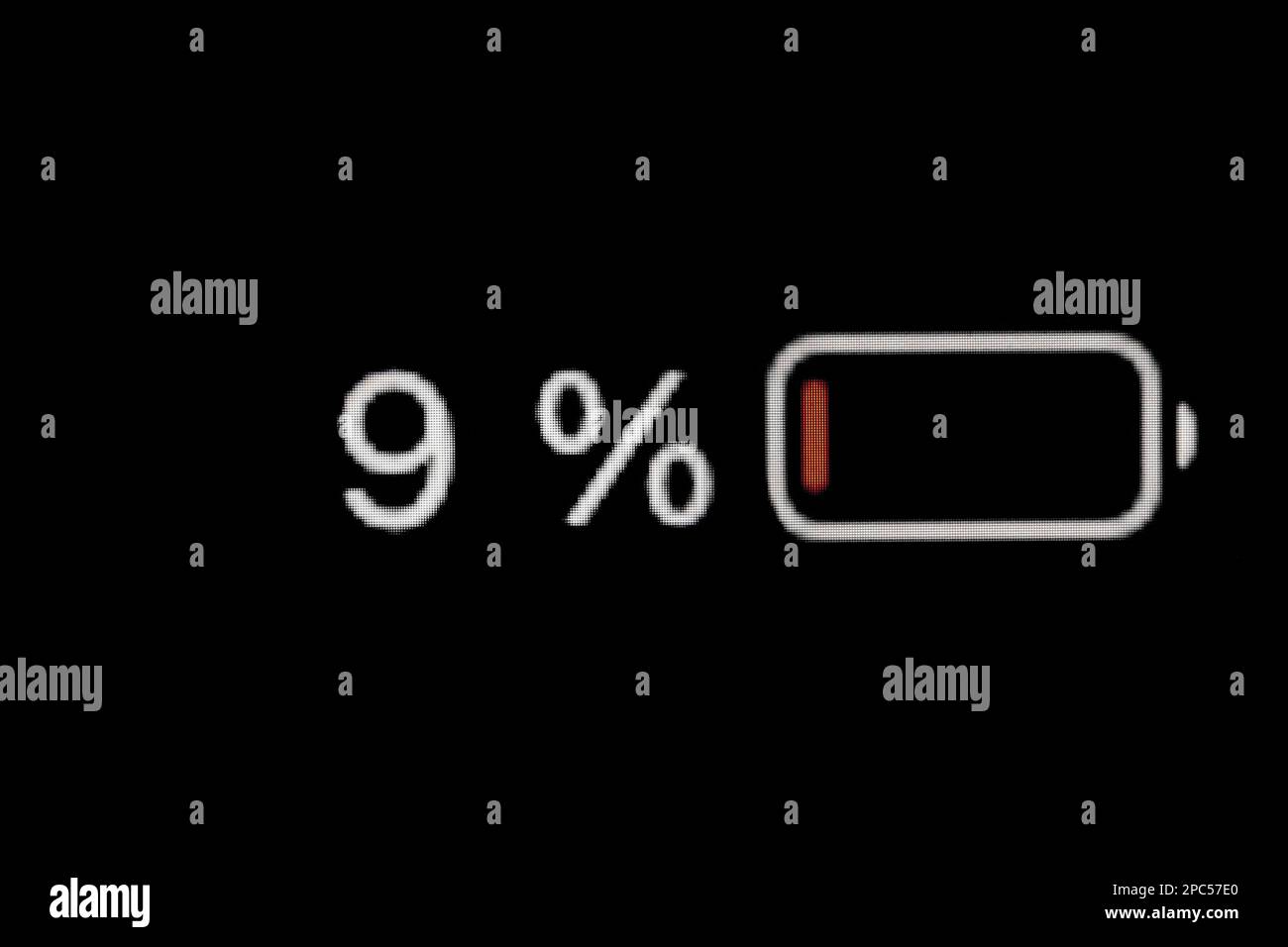 Smartphone charged battery level indicator - nine, 9 percent: close up ...