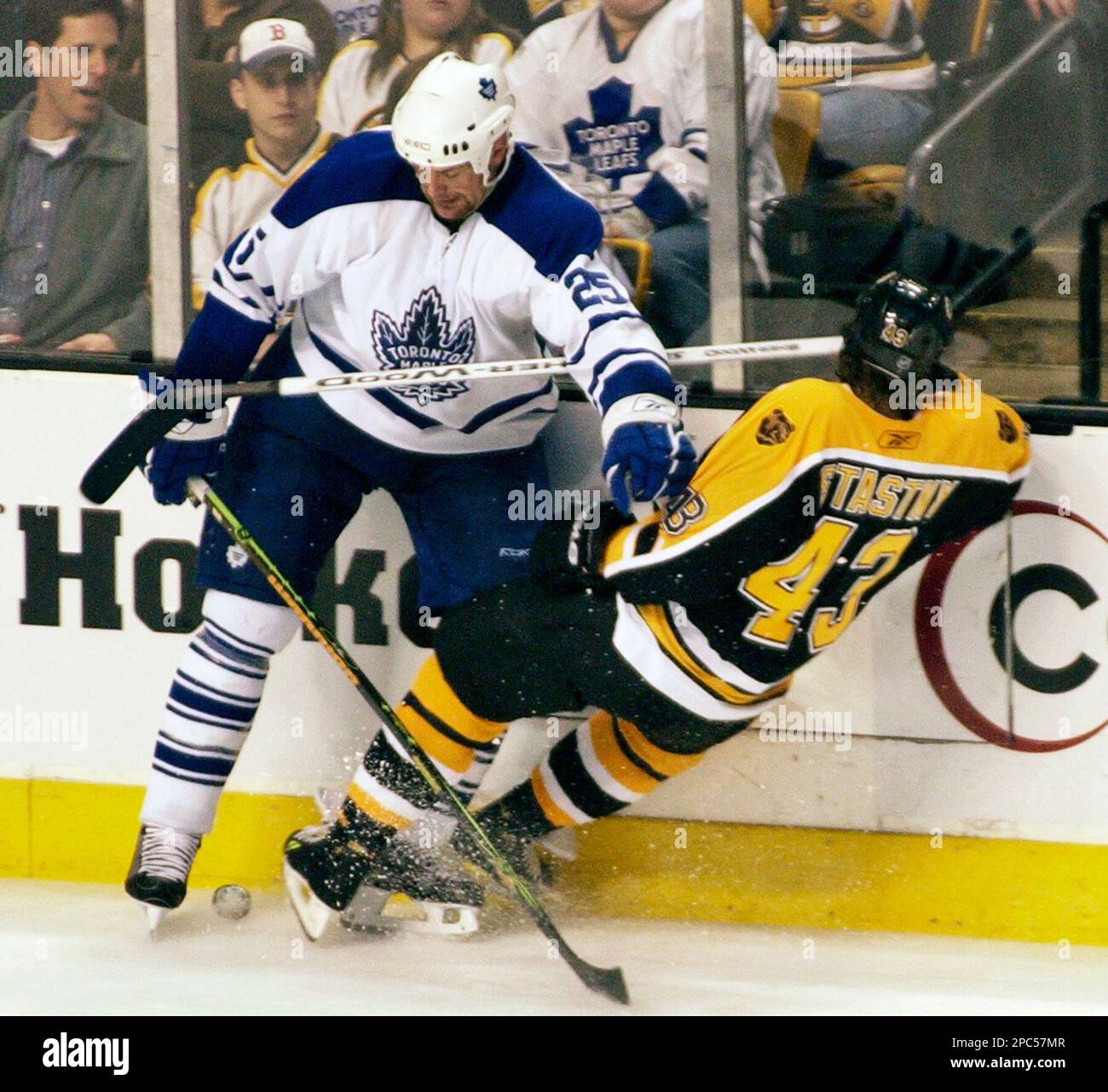 Toronto Maple Leafs' Hal Gill (25) knocks down Boston Bruins' Yan ...