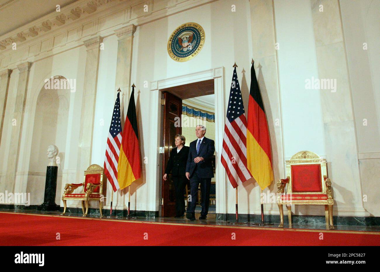 President Bush, right, and German Chancellor Angela Merkel arrive to ...