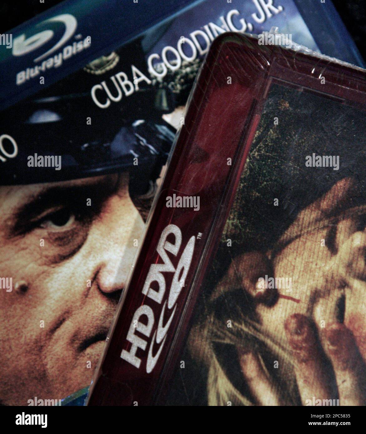 DVD discs bearing competing brand names, Toshiba's HD DVD, right and ...
