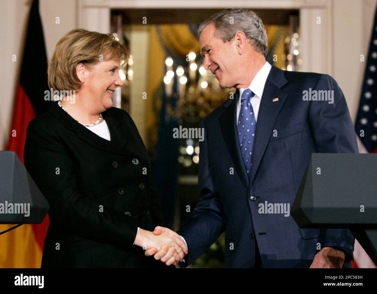 President Bush, right, and German Chancellor Angela Merkel finish a ...