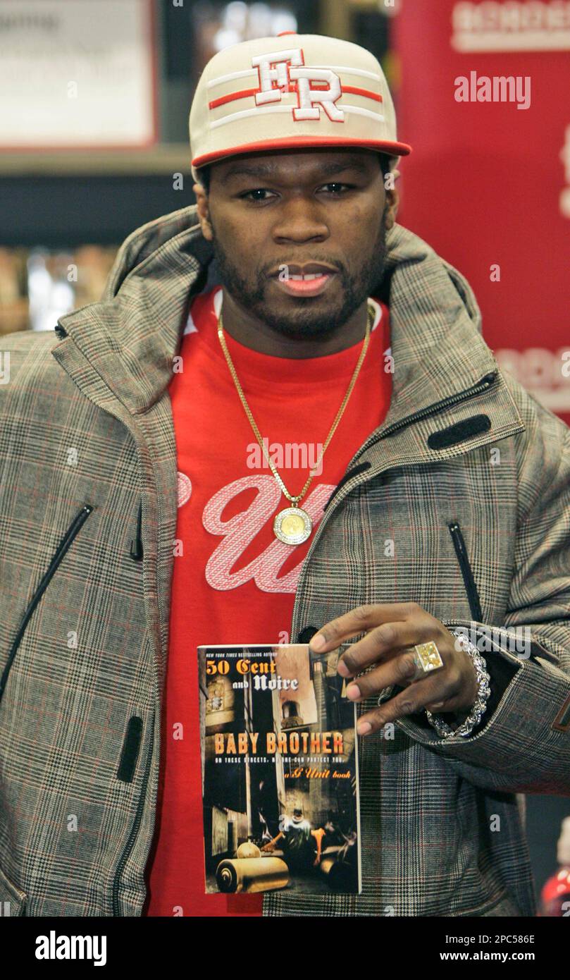Rapper and actor 50 Cent poses for pictures during a book signing in ...