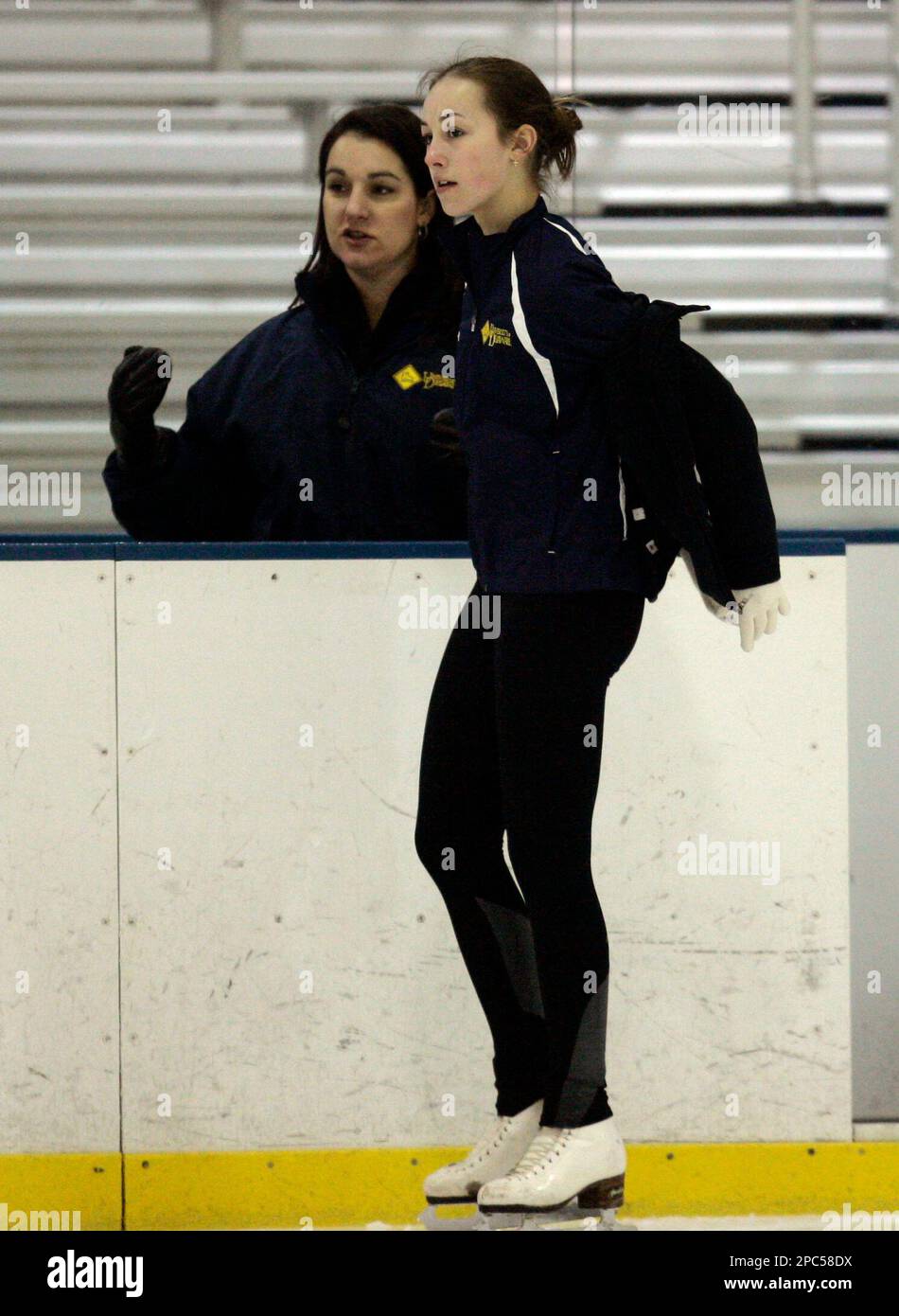 World Figure Skating Champion Kimmie Meissner, right, listens to ...