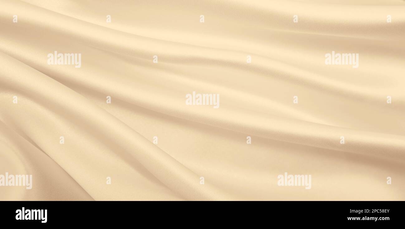Smooth elegant golden silk or satin luxury cloth texture can use as ...