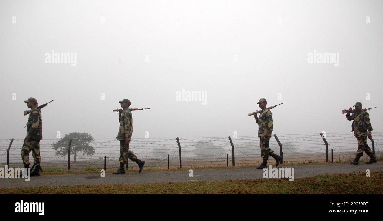 Indian Border Security personnel patrol along the Indo-Bangladesh ...