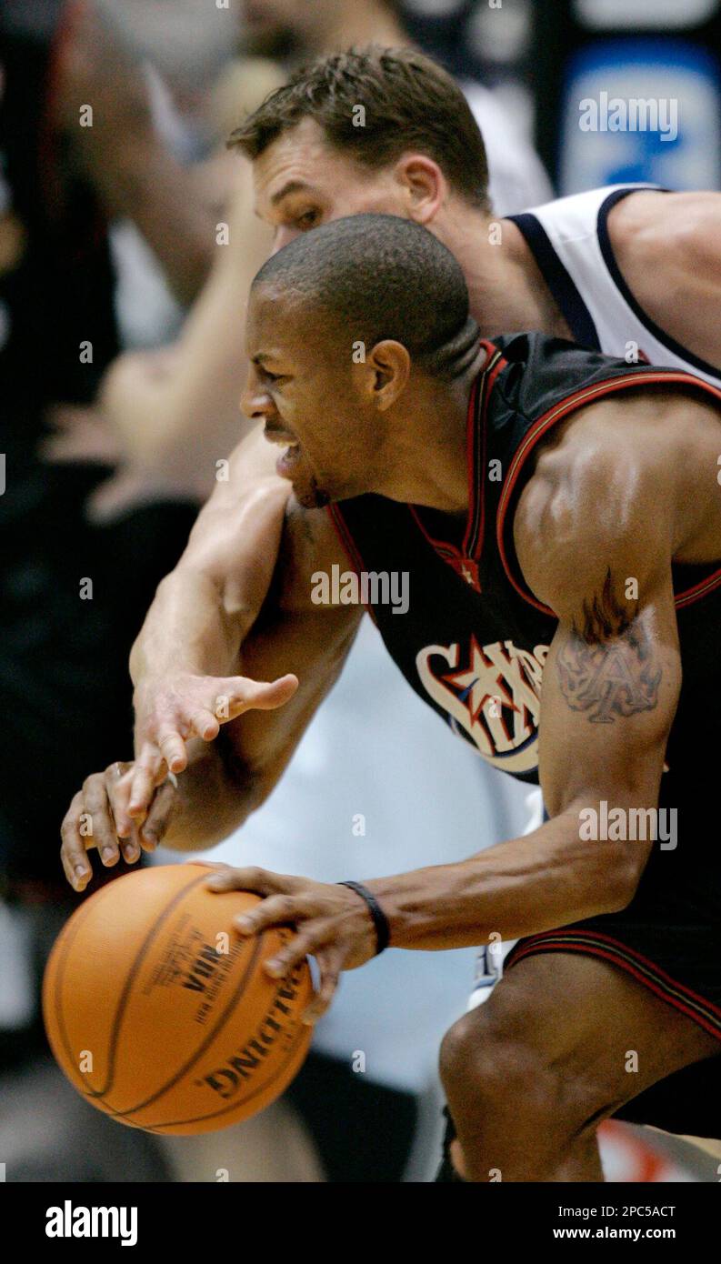 Utah Jazz forward Matt Harpring (15), rear, reaches around Philadelphia ...