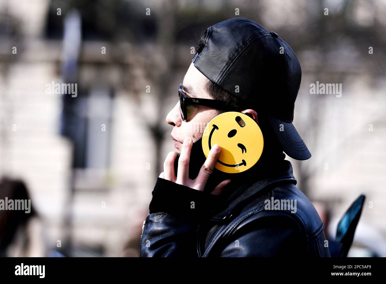 Guest with a smiley phone - Street Style at Paris Fashion Week - France ...