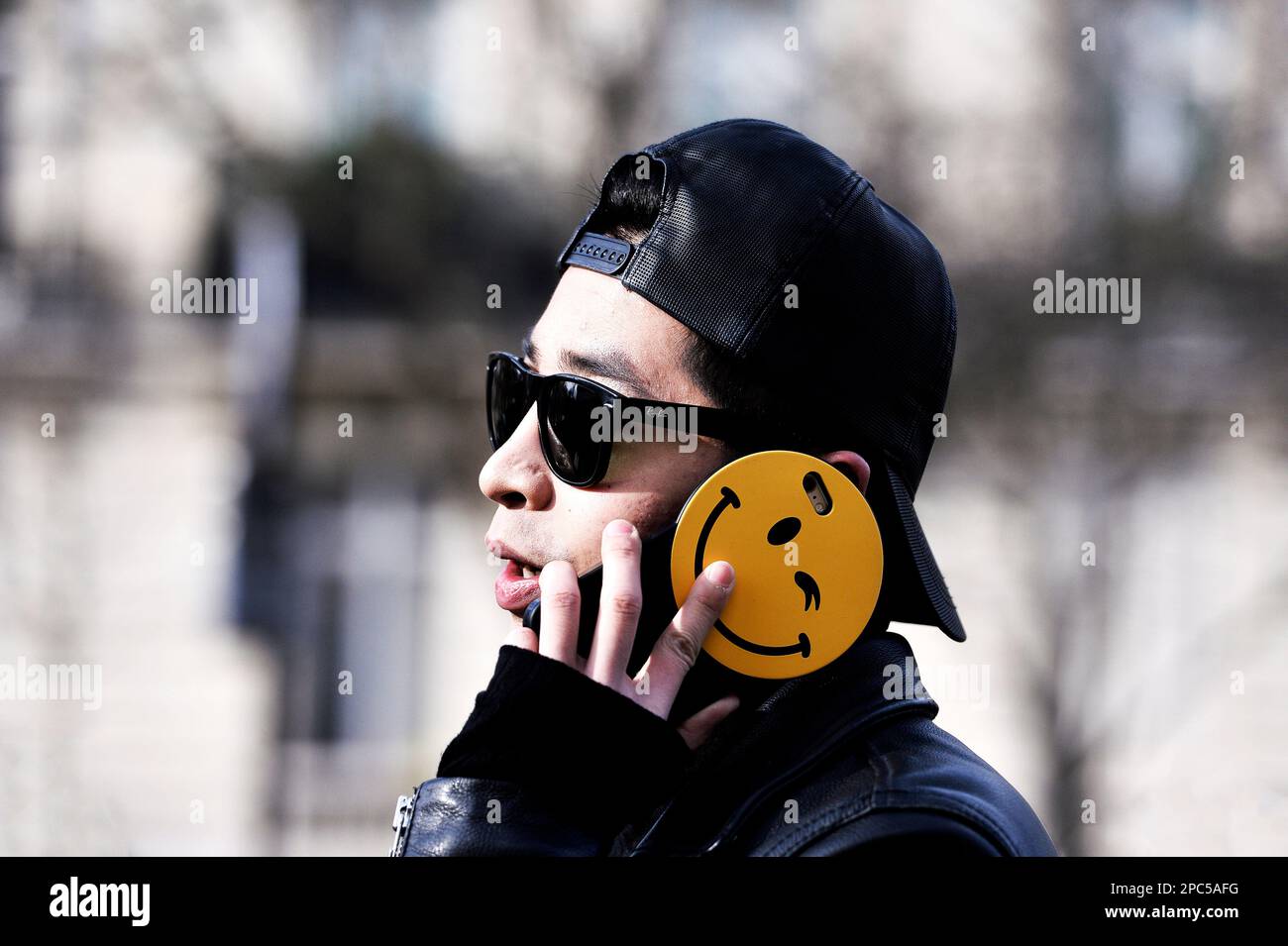 Guest with a smiley phone - Street Style at Paris Fashion Week - France ...
