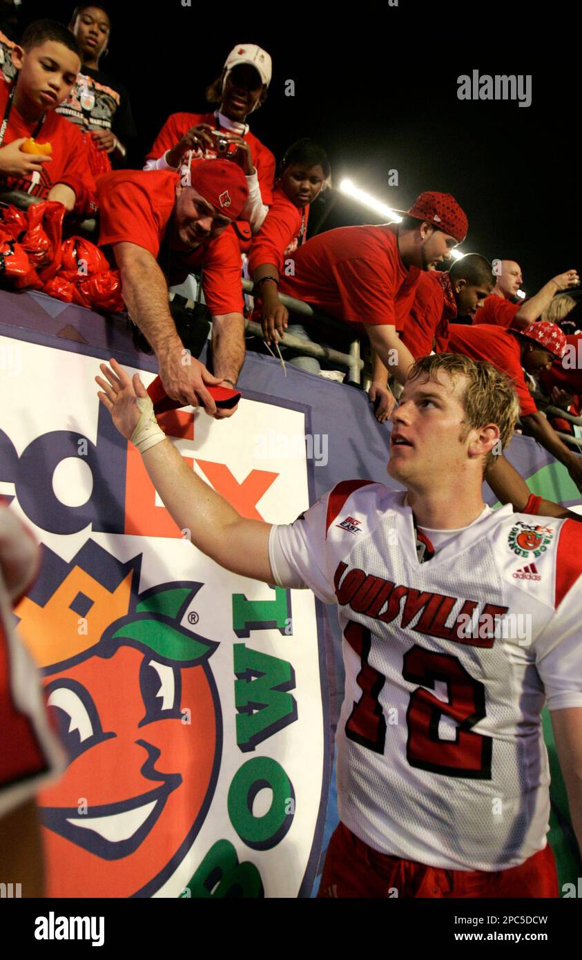 Louisville quarterback Brian Brohm (12) celebrates with fans after ...