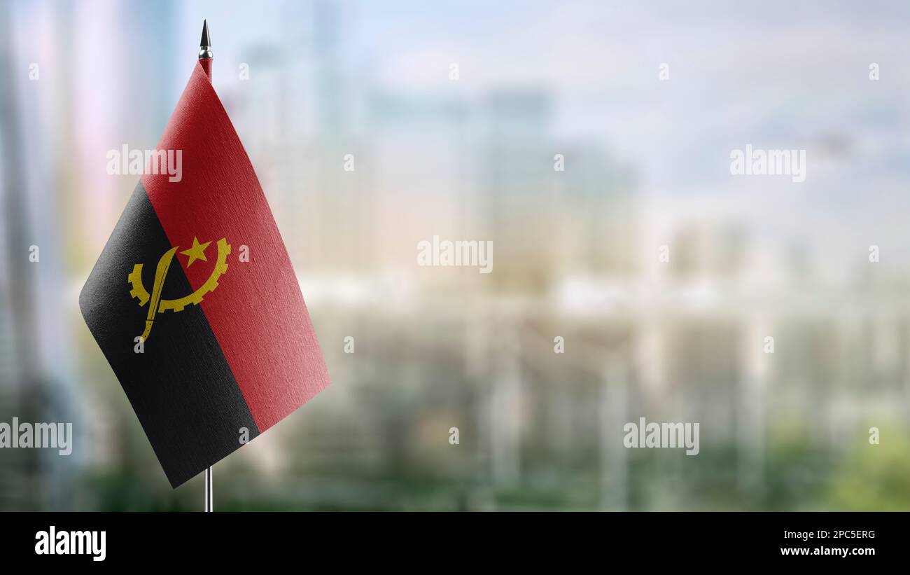 A small Angola flag on an abstract blurry background Stock Photo - Alamy