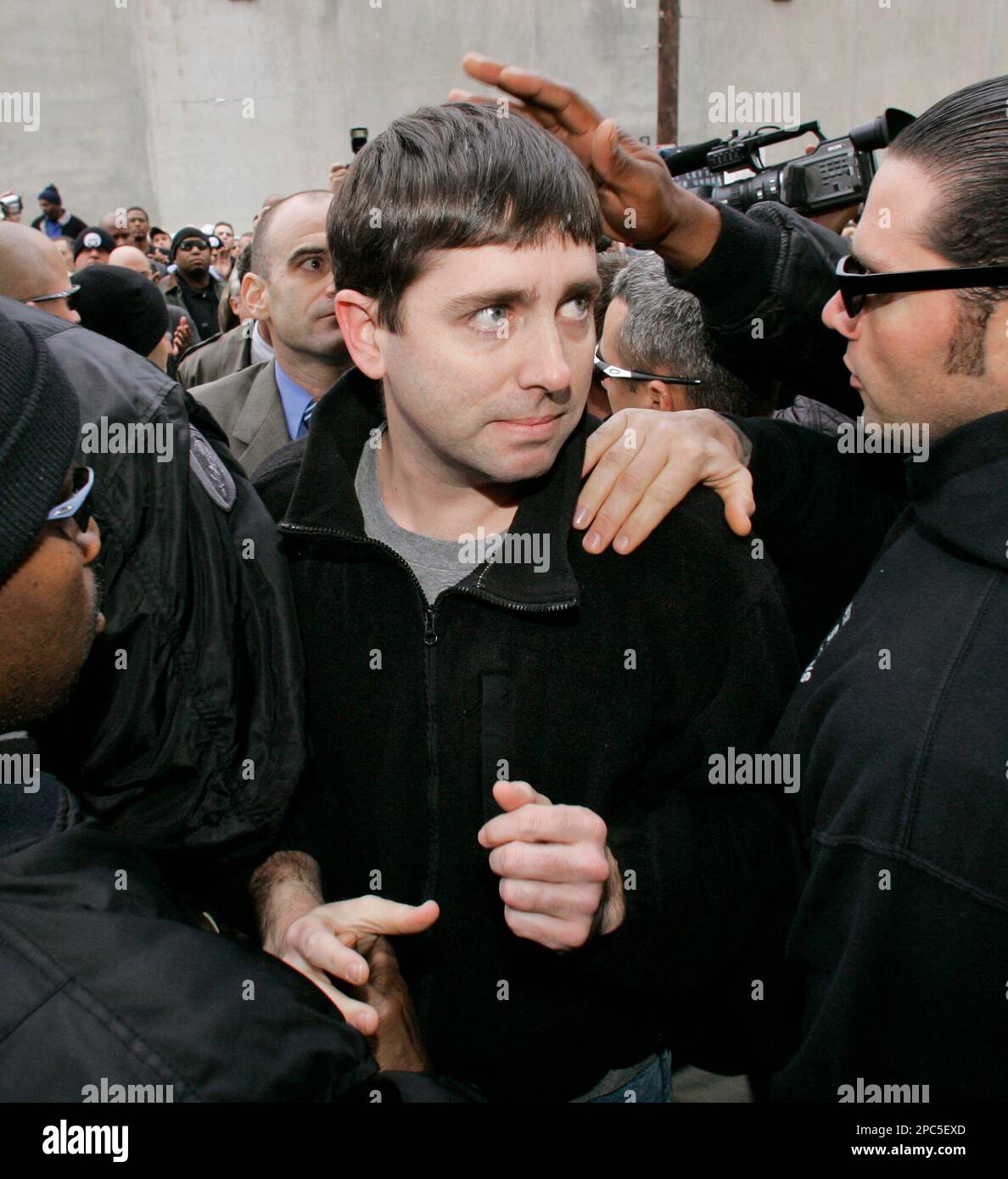 Michael Hunter Jr., center, shakes hands with a fellow officer as he ...