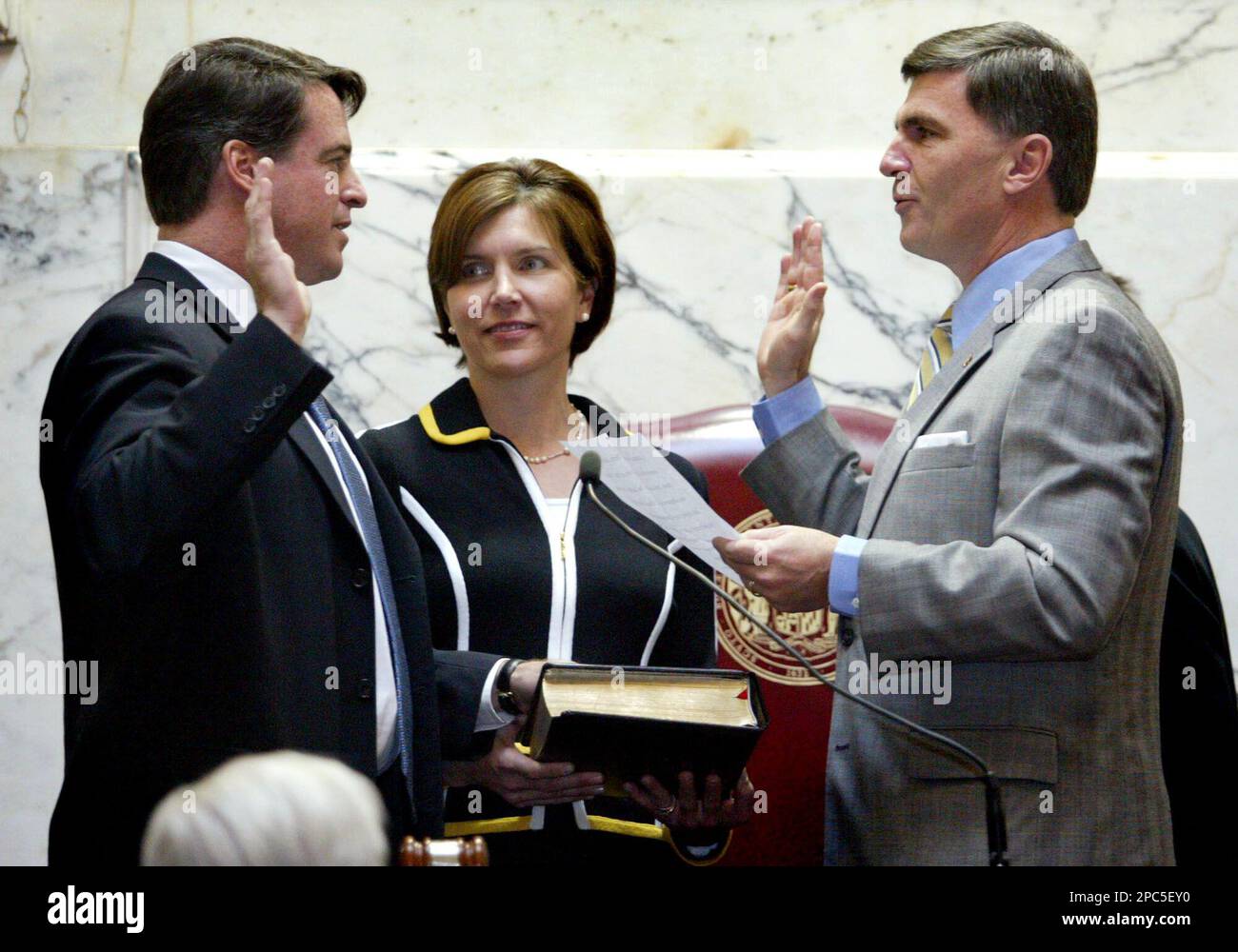 Doug Gansler, left, is sworn as the new Maryland Attorney General by ...