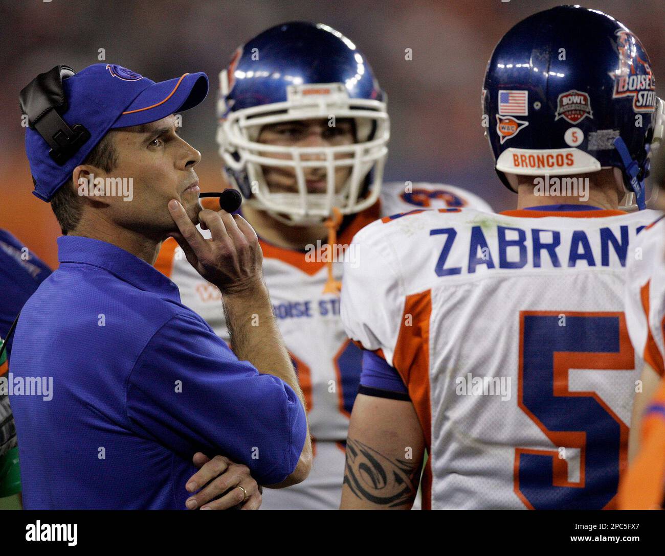Boise State head coach Chris Petersen talks with quarterback Jared ...