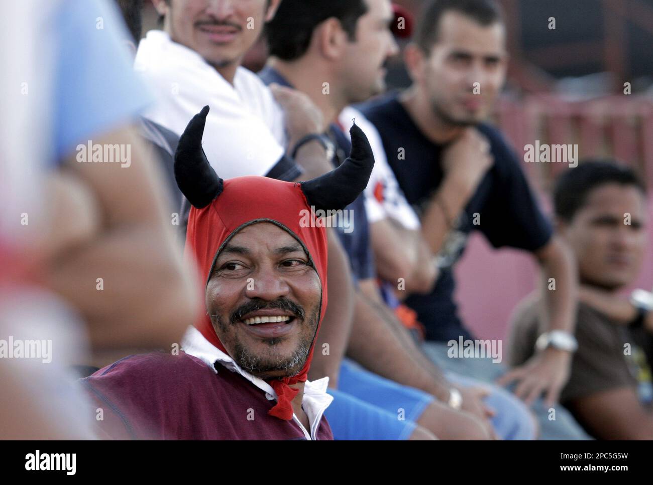 "El Diablo" waits with other Costa Rican men to take part in ...