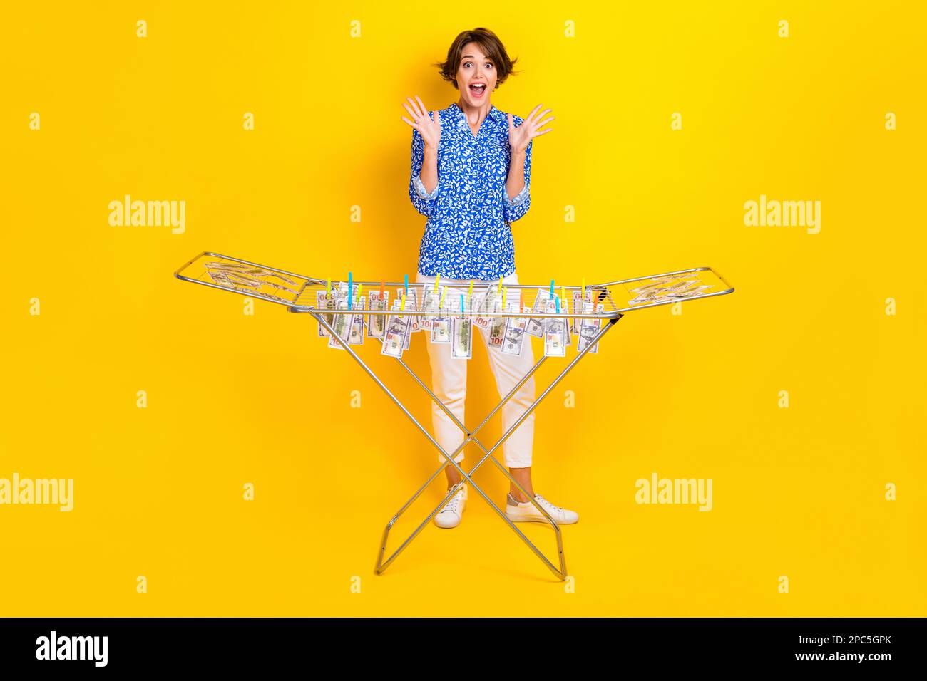 Full body photo of attractive woman impressed raise hands launder money ...