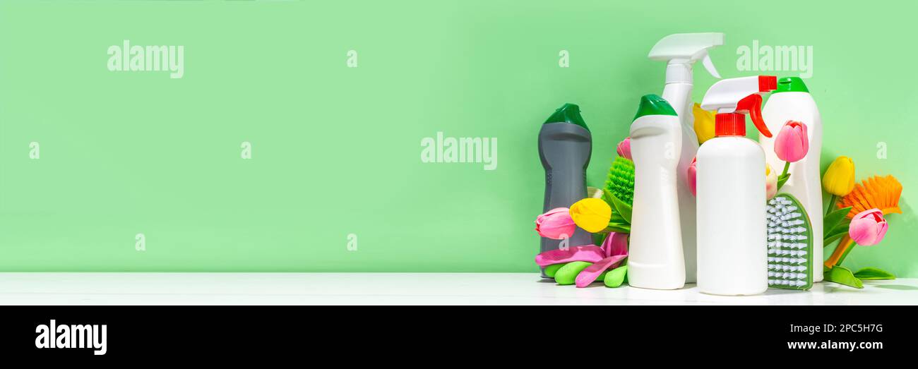 Set of cleaning supplies and utensils, with spring flowers on high ...