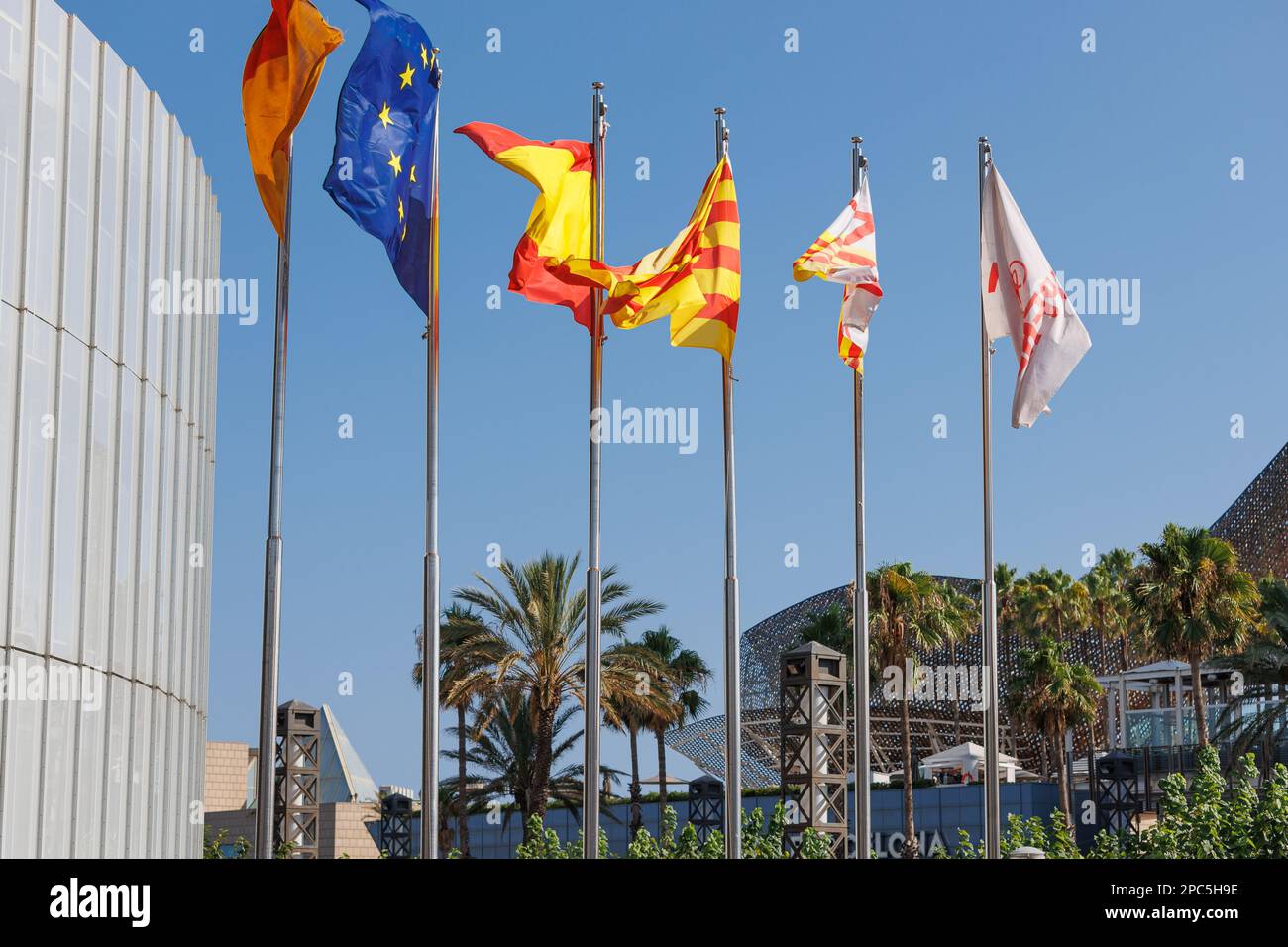 Flags waving against Blue Sky Outside Public Building Stock Photo - Alamy
