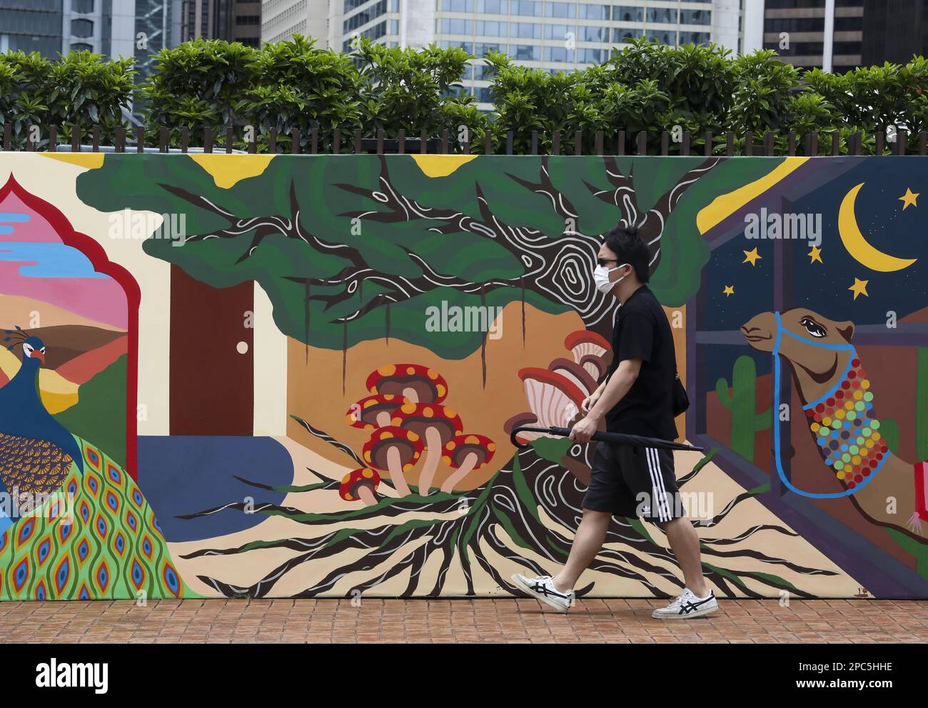 A colourful mural from HKwalls outside the Hong Kong Observation Wheel ...