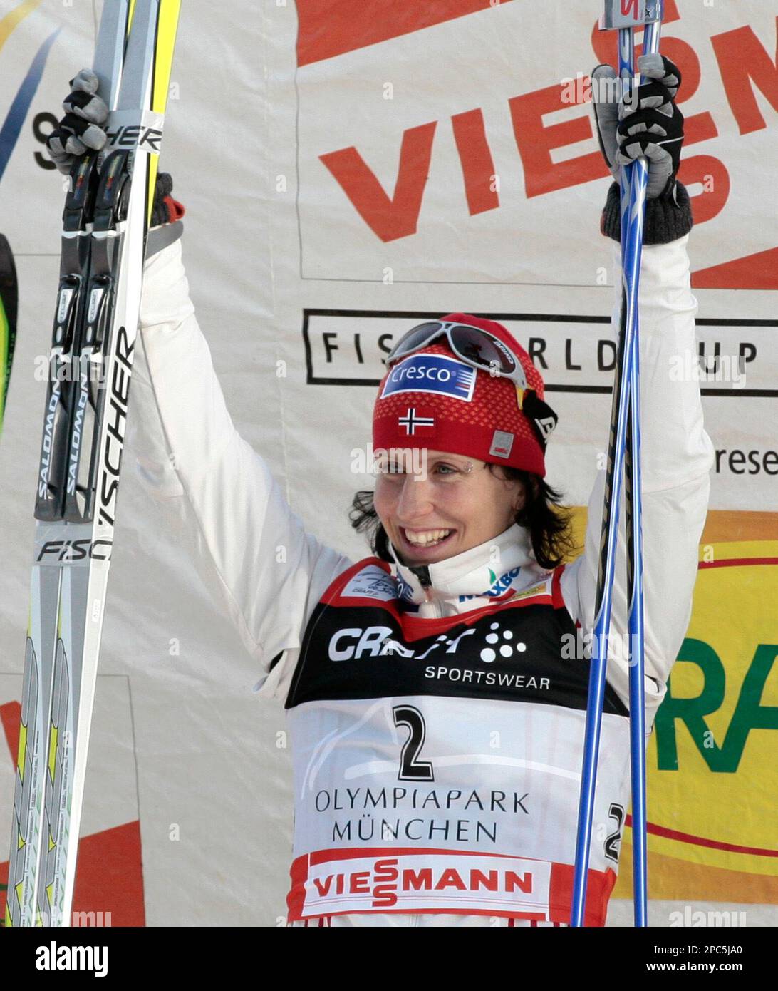 Winner Marit Bjoergen from Norway celebrates on the podium during the ...