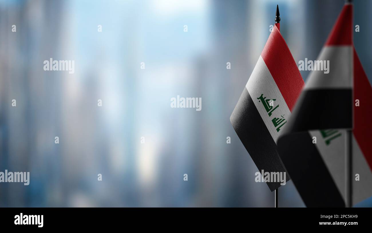 Small flags of the Iraq on an abstract blurry background Stock Photo ...