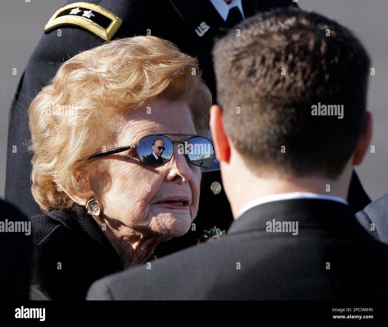 Betty Ford looks at an unidentified family member, right, as the face ...