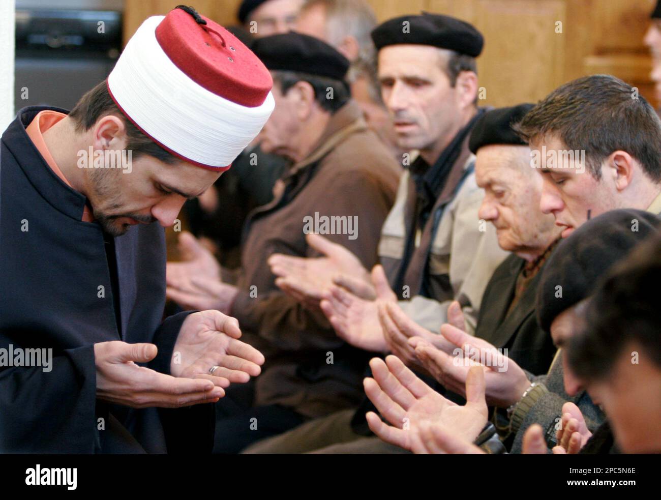 Bosnian Muslim men pray at the White mosque in Srebrenica on the first ...