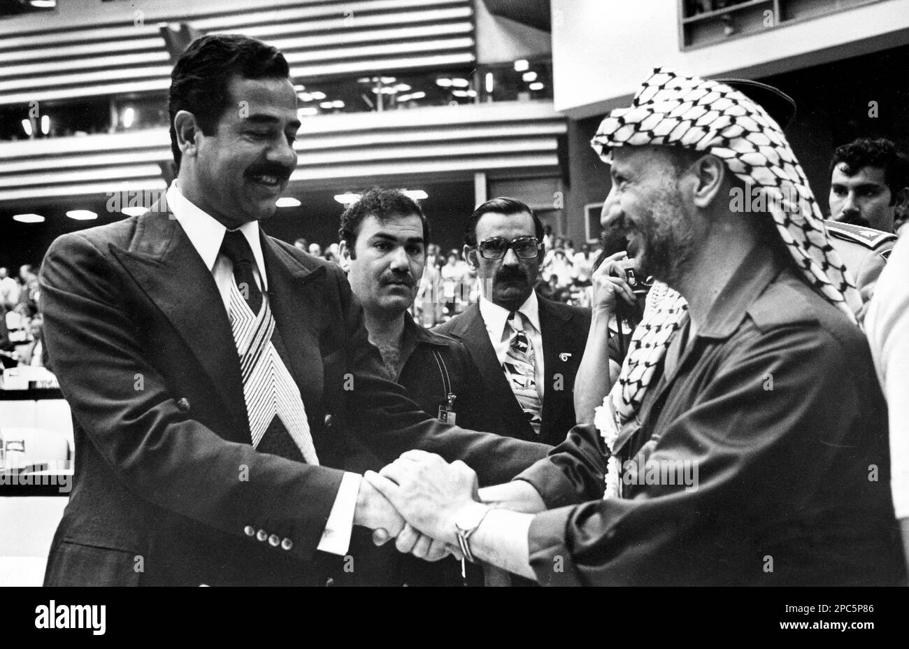 **FILE*** Iraqi President Saddam Hussein, left, greets Yasser Arafat ...