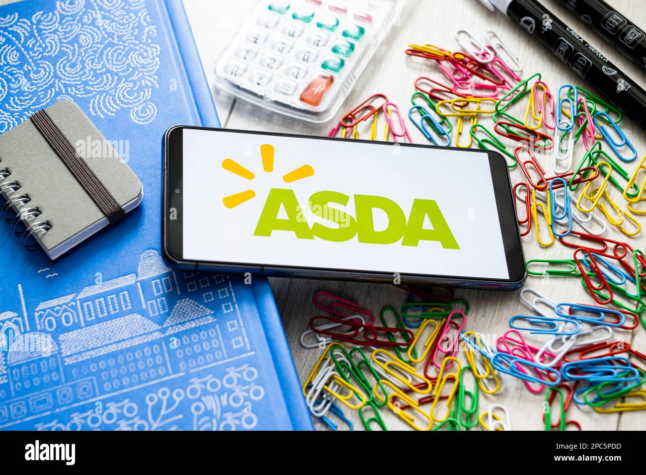 In this photo illustration a ASDA logo seen displayed on a smartphone ...