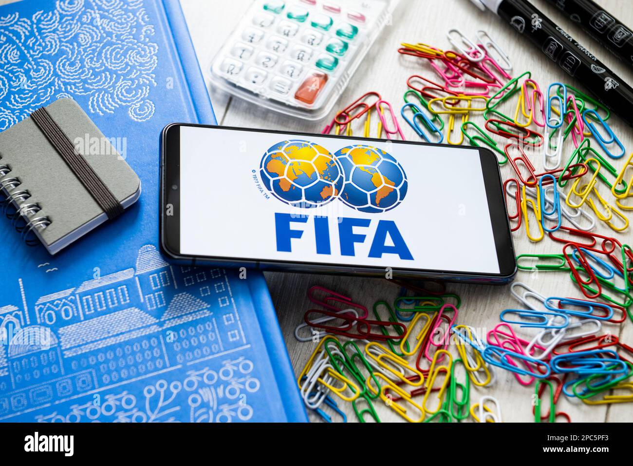 In this photo illustration a FIFA logo seen displayed on a smartphone ...
