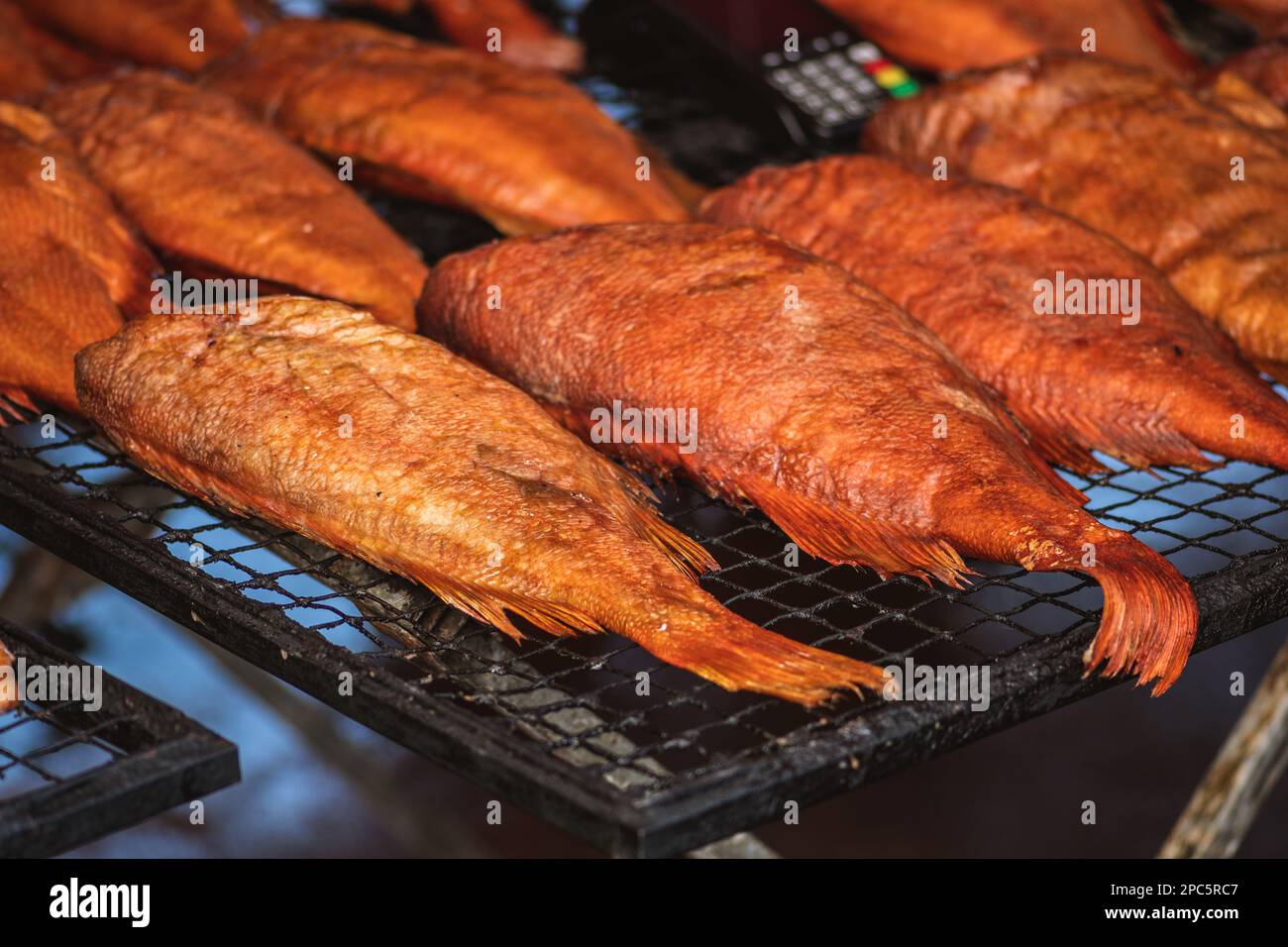 Selling various smoked fish in a street food market in Vilnius ...