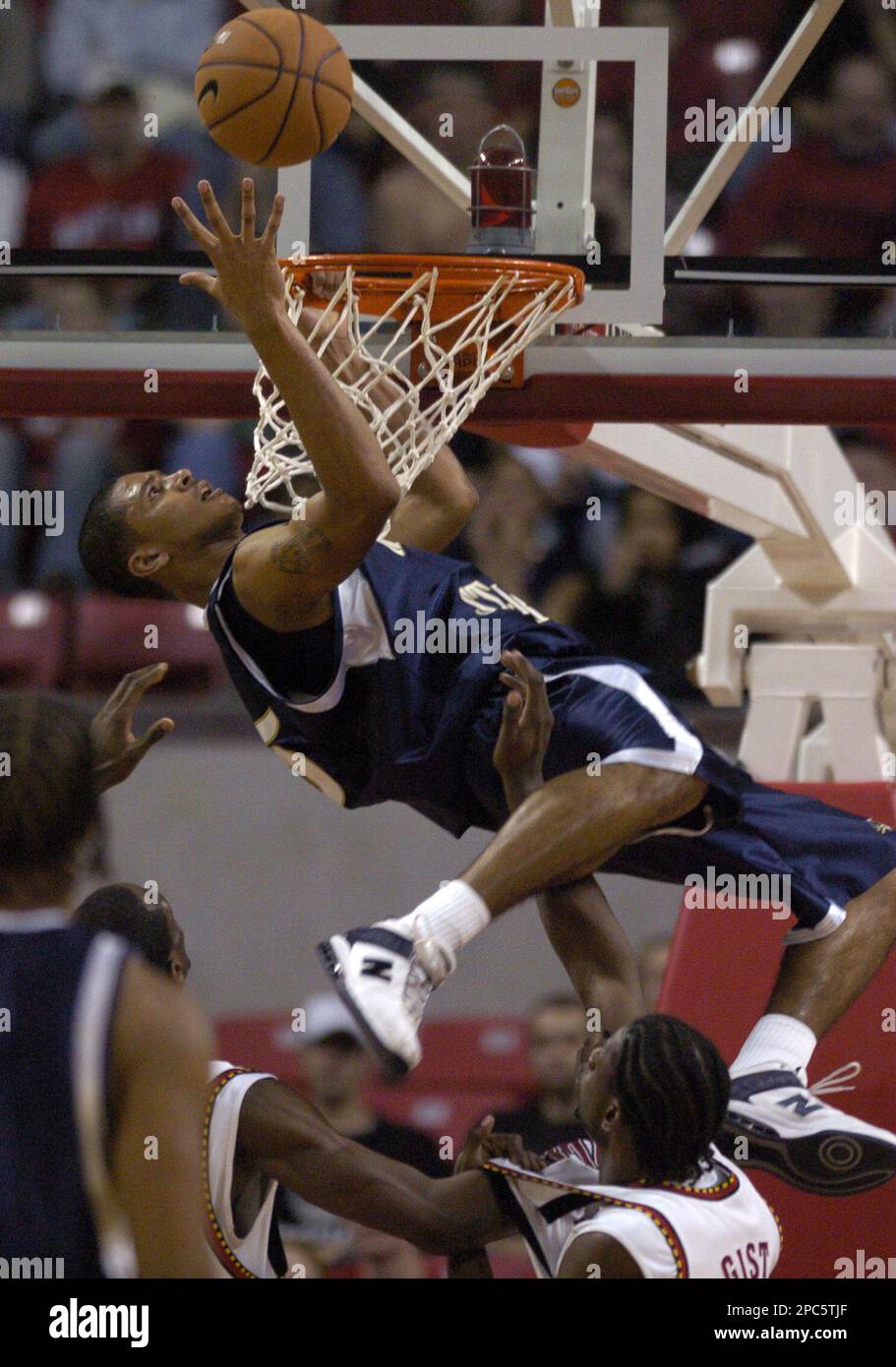 Mount Saint Mary's Kelly Beidler hangs on the basket after missing a ...