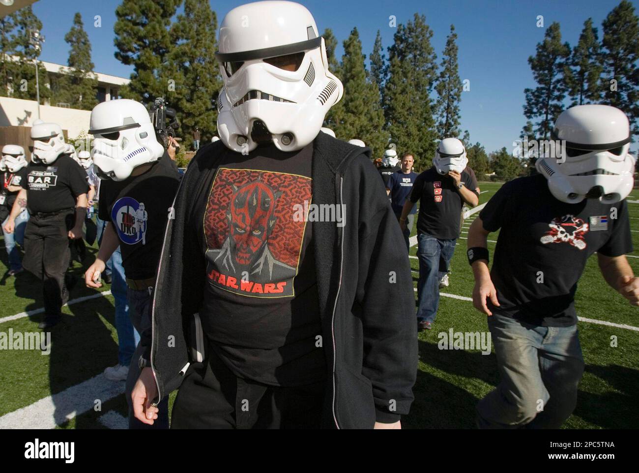 Fans dressed as "Star Wars" Stormtroopers, practice marching for the ...