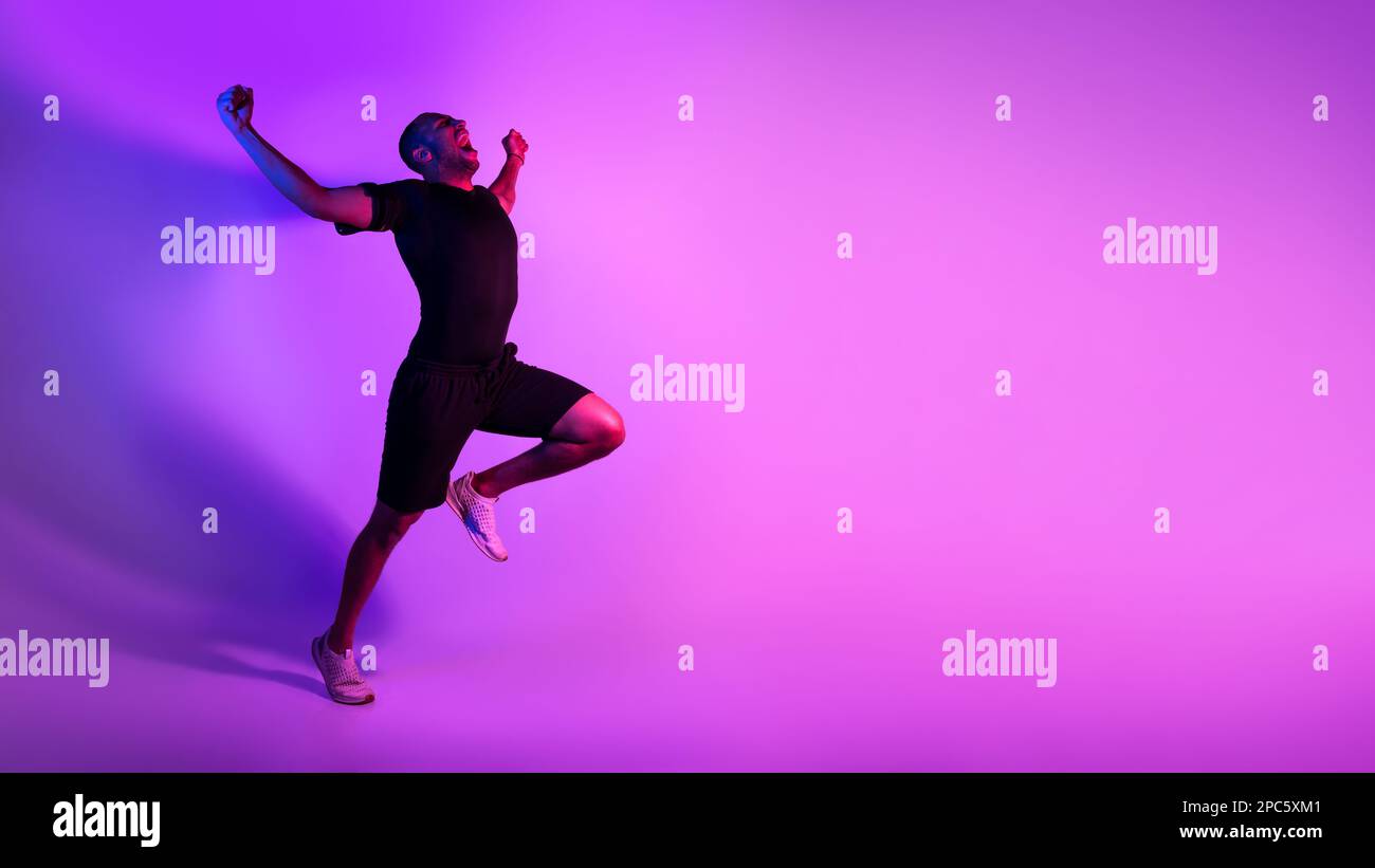 Black Athlete Man Running Celebrating Victory Shouting Over Purple ...
