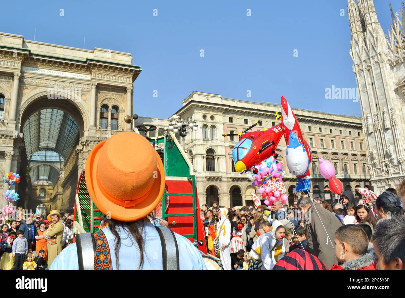 Festive crowd dressed as carnival watch a circus show "Il Criceto ...