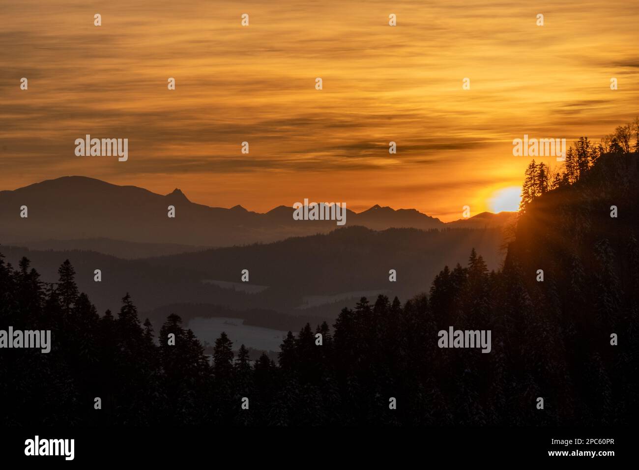 February evening in Pieniny - Sokolica. Setting sun on the background ...
