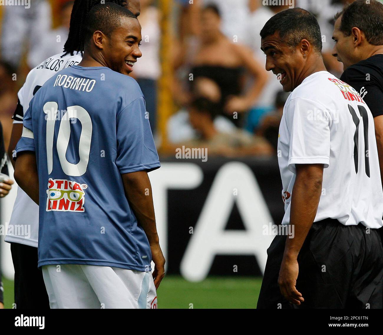 Brazilian striker Robinho, from Spanish club Real Madrid, left, jokes ...
