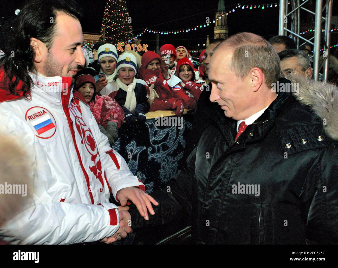 Russian President Vladimir Putin, right, greets figure skating star ...