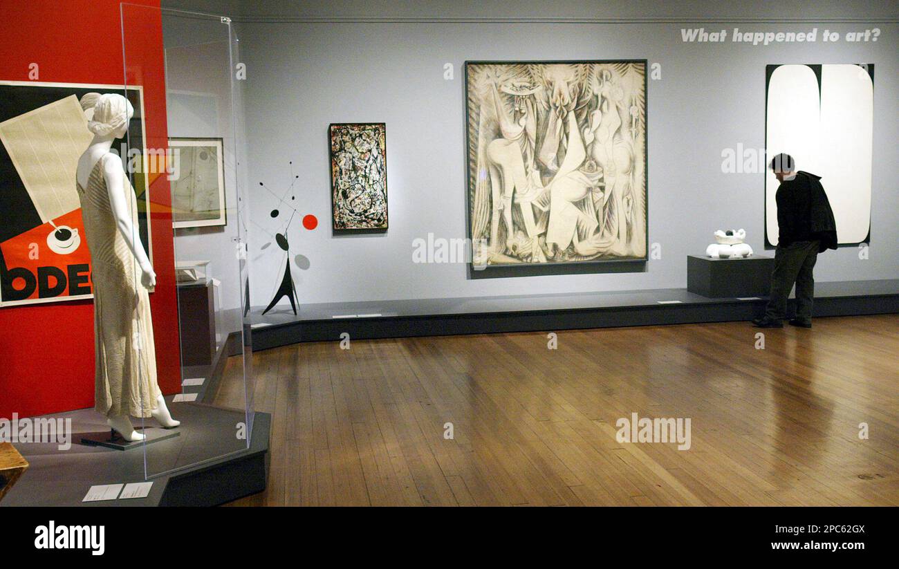A man views an exhibit examining art in the 20th century at the Rhode ...