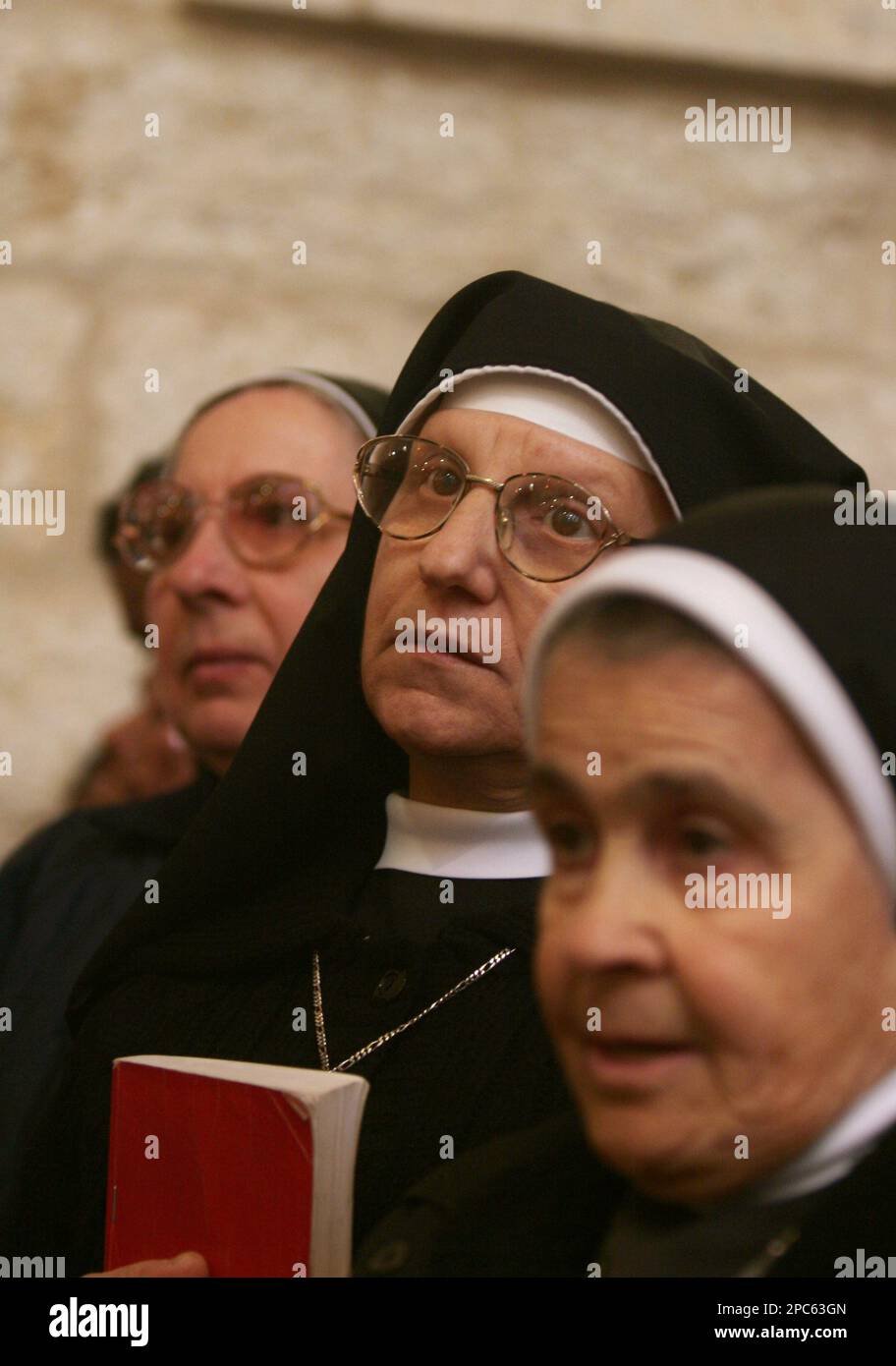 Nuns take part in Christmas mass at the Church of the Nativity ...