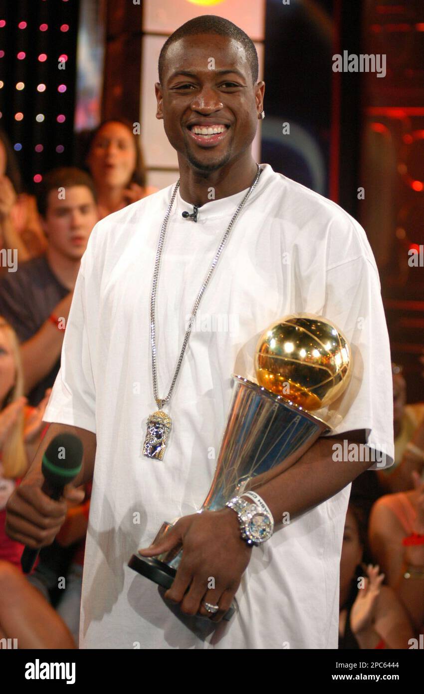 ** FILE **Miami Heat's Dwyane Wade holds his MVP trophy from the NBA ...