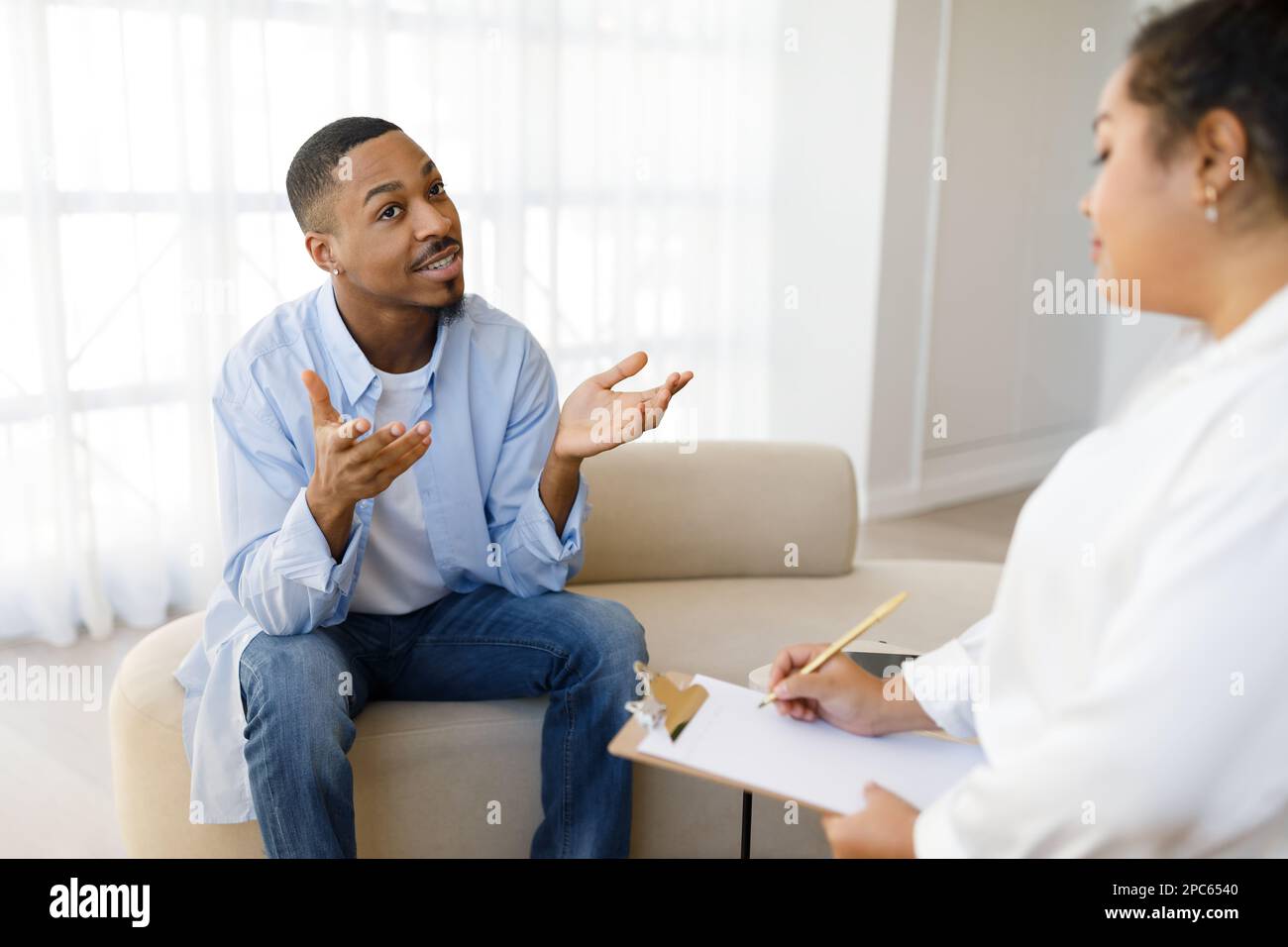Handsome black guy attend therapy session with psychologist Stock Photo ...