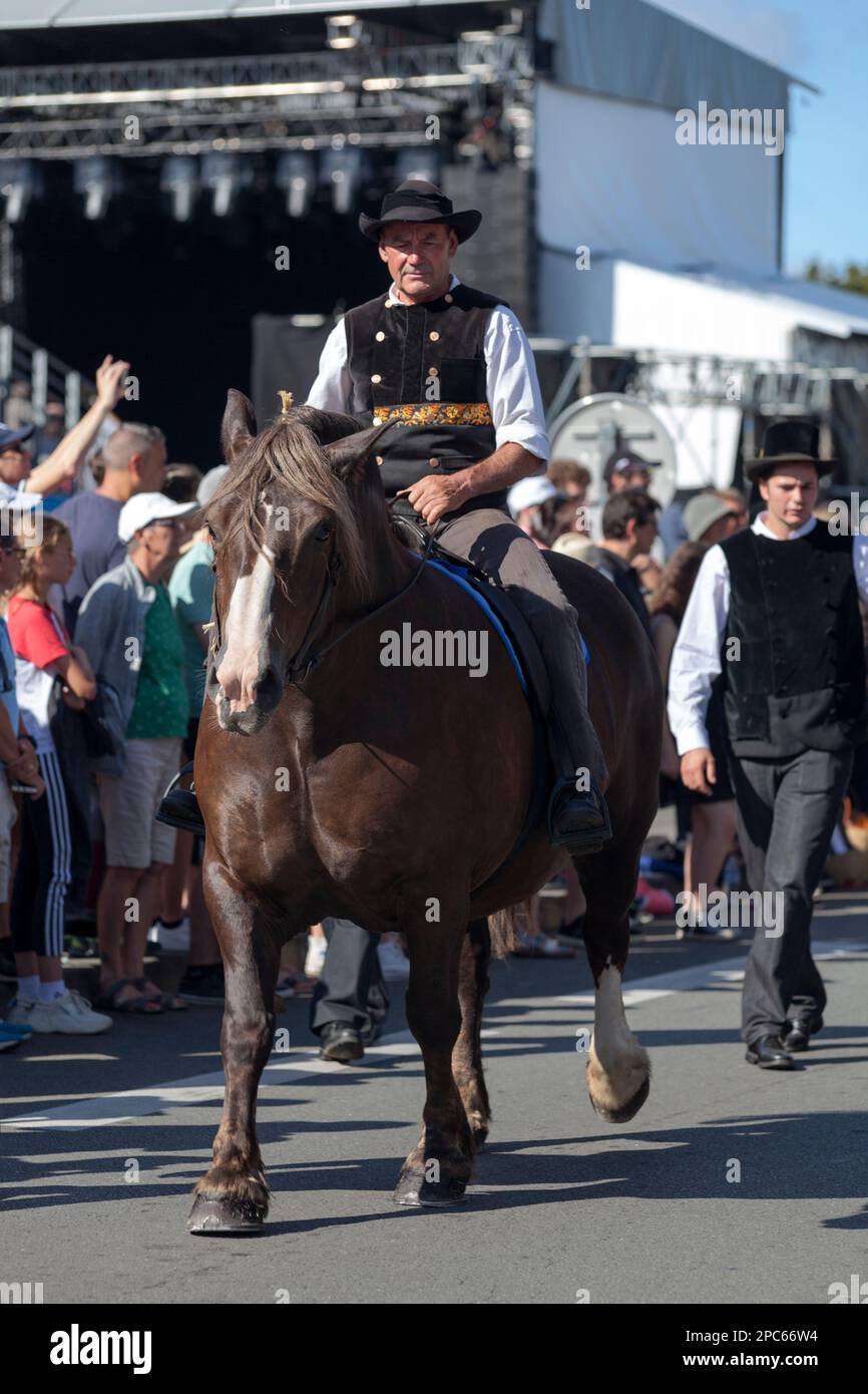 Quimper, France - July 24 2022: Rider in traditional Breton dress ...