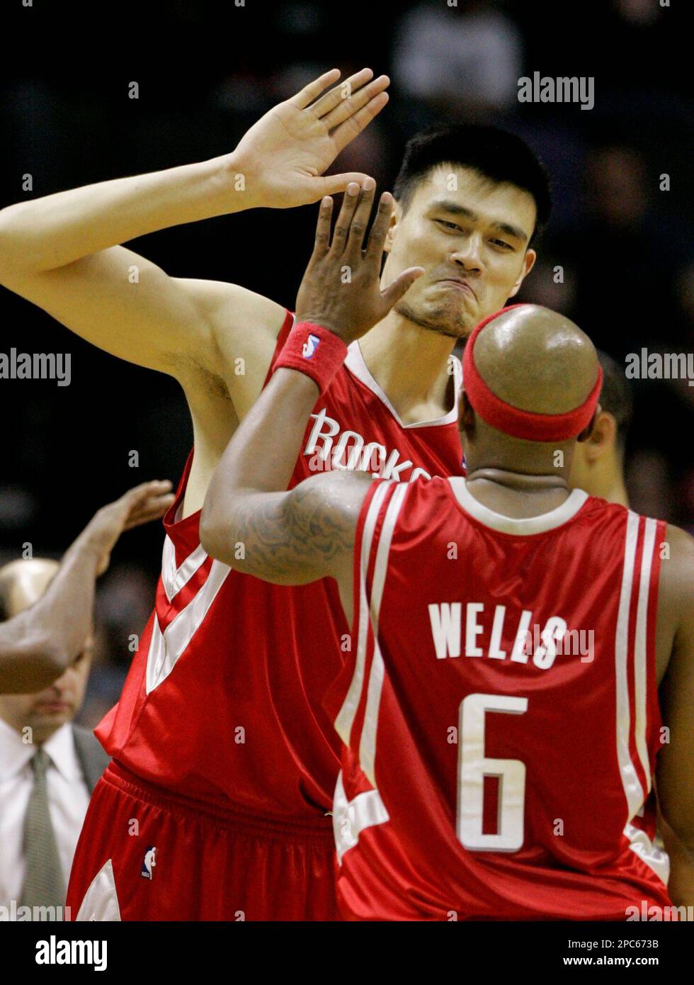Houston Rockets center Yao Ming, of China, celebrates with guard Bonzi ...