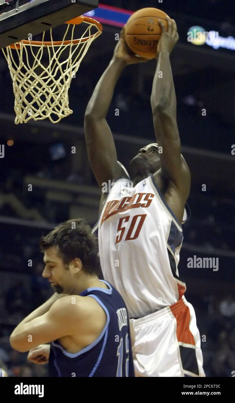Charlotte Bobcats forward Emeka Okafor dunks over Utah Jazz forward ...