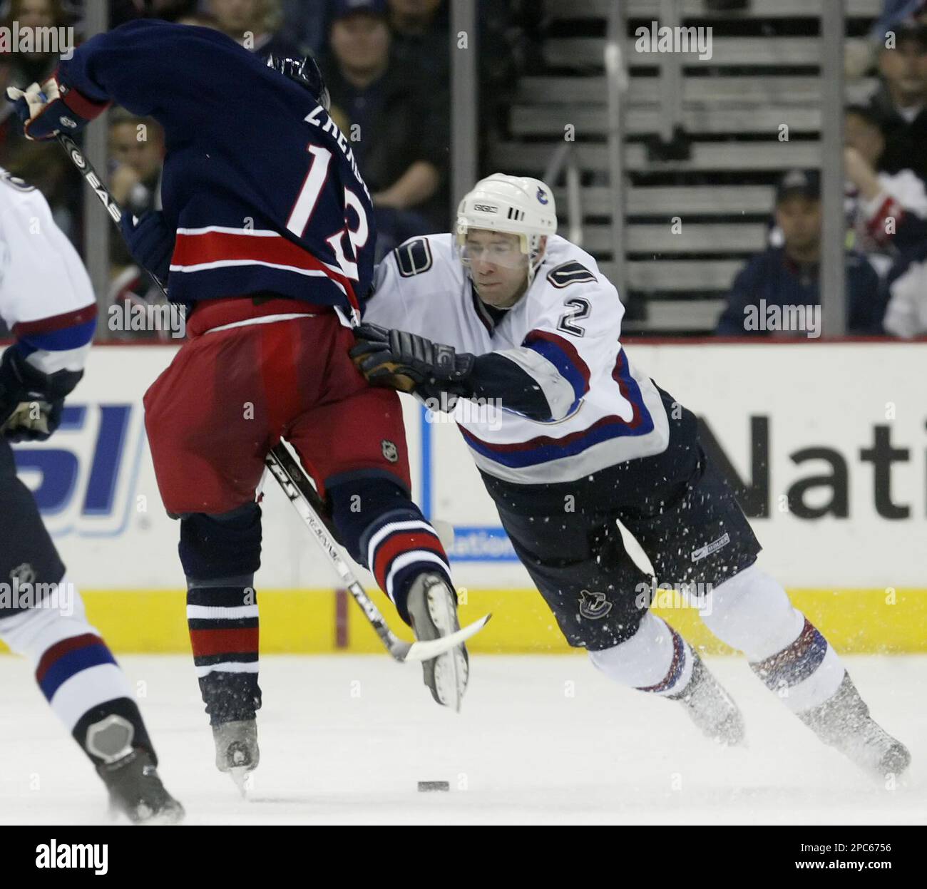 Vancouver Canucks' Mattias Ohlund, right, of Sweden, checks Columbus ...
