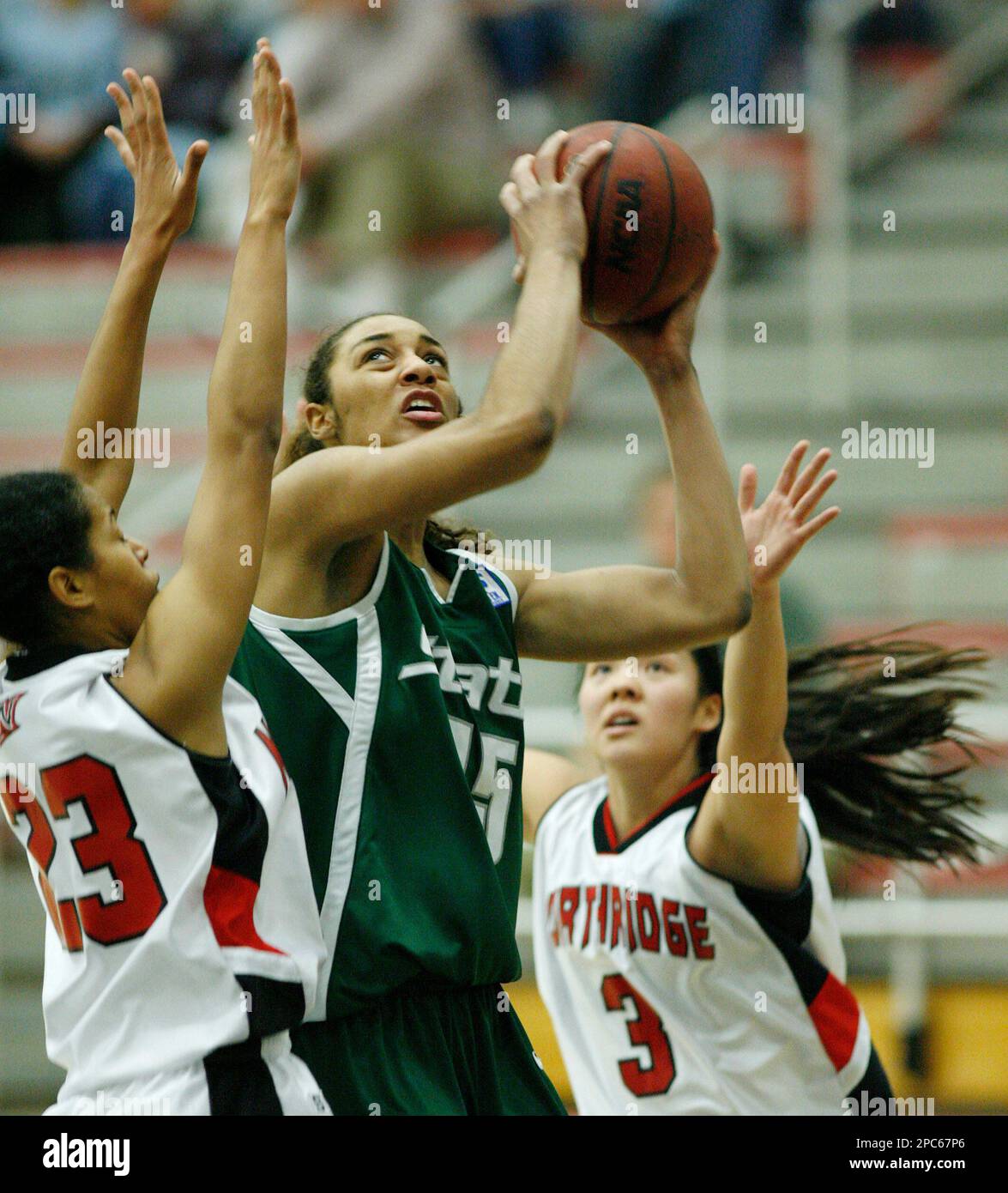 Michigan State forward Myisha Bannister, center, shoots between Cal. State Northridge players ...