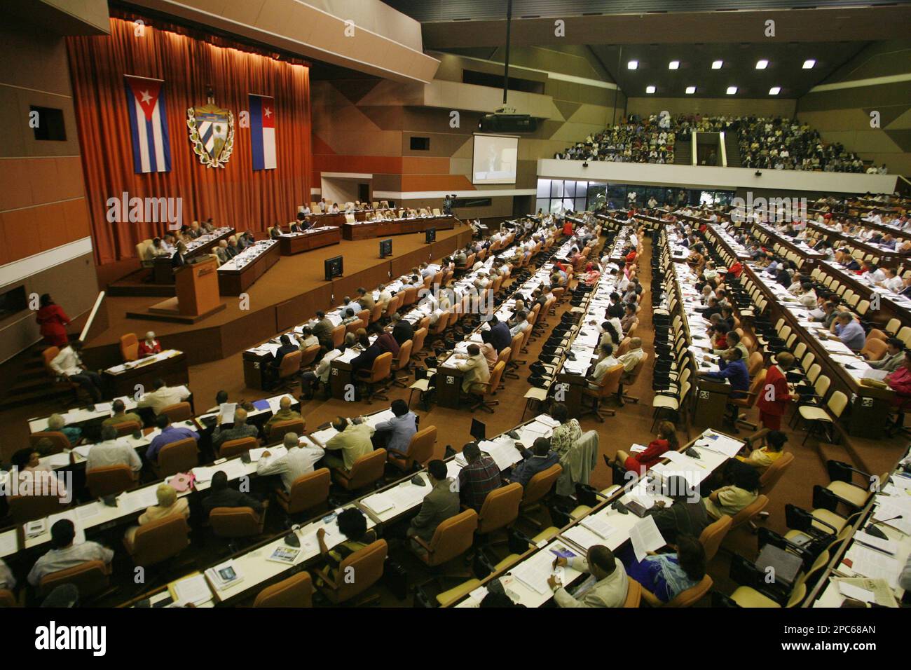 Cuban deputies of the Communist Party attend the year-end session of ...