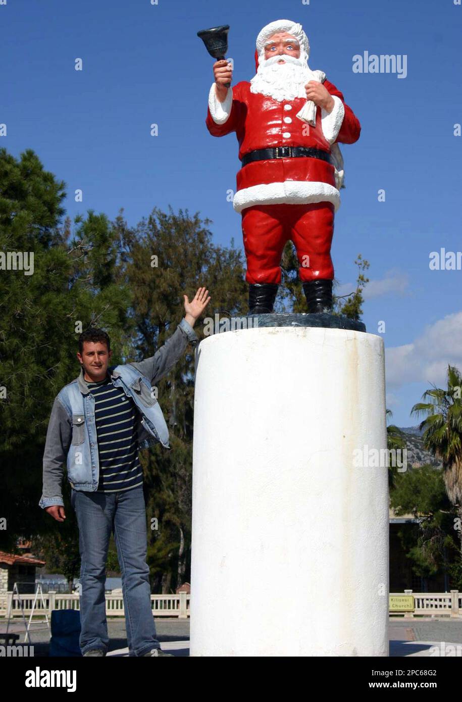 A Turkish man points at the new Santa Claus statue in Mediterranean ...